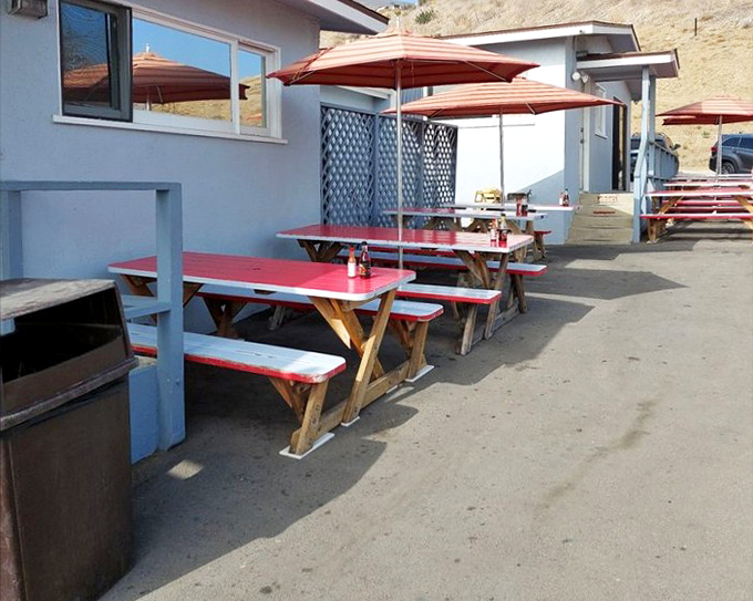 Red-topped picnic tables under umbrellas offer respite from the sun while you feast. Seaside dining without the white tablecloth markup.