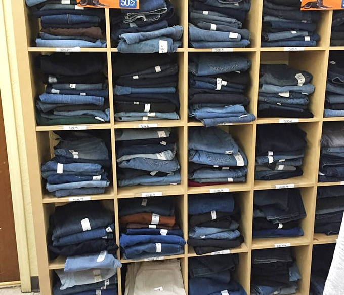 Denim paradise! Perfectly organized jeans in every shade of blue imaginable. Someone's perfect pair is hiding in this textile library.