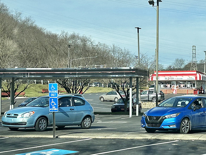 Cars gather in the parking lot like pilgrims at a shrine to American food culture, each vehicle containing hungry occupants about to experience a taste of roadside Americana.