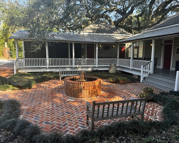 Brick courtyard simplicity with a touch of Southern hospitality. The kind of space where rocking chairs and sweet tea should be mandatory.