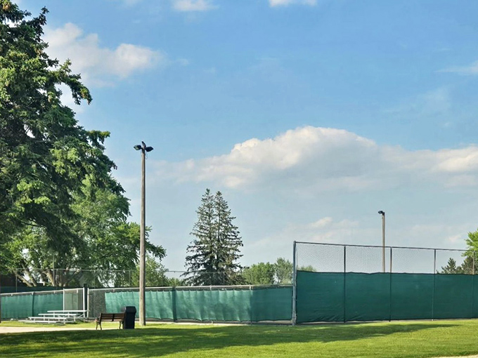 This pristine court isn't just for recreation—it's where community happens, one pickleball match at a time, under Minnesota's impossibly blue summer skies.