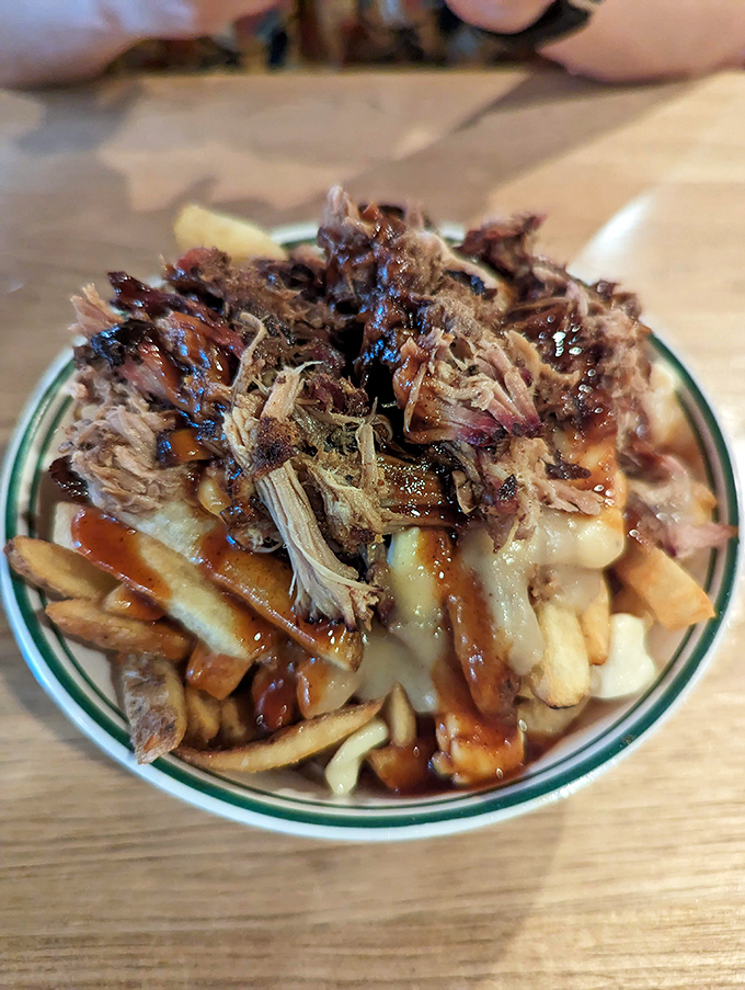 Poutine gets a southern makeover with pulled pork on top. French fries, cheese, gravy, AND barbecue? This is what happens when Canada and Texas collaborate.