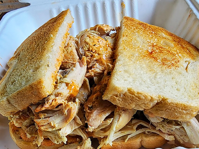 A sandwich so honest it should run for office&mdash;thick-cut bread barely containing a mountain of tender pulled chicken that means business.