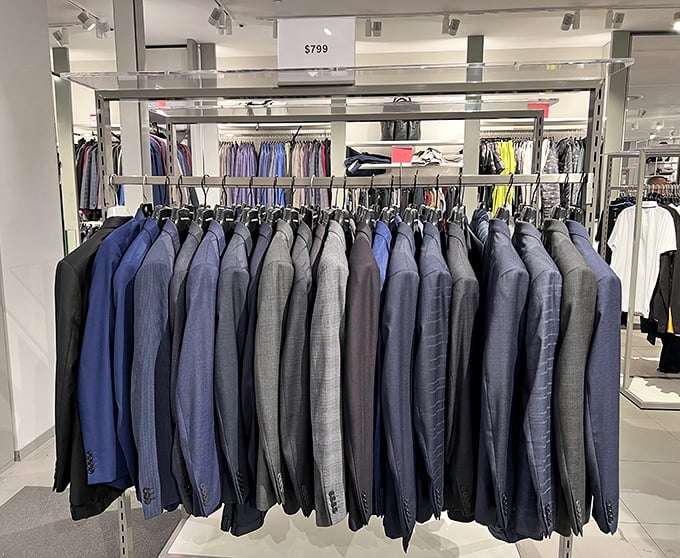 A sea of blue and gray suits awaits their forever homes. Business attire that says "corner office" without screaming "second mortgage."