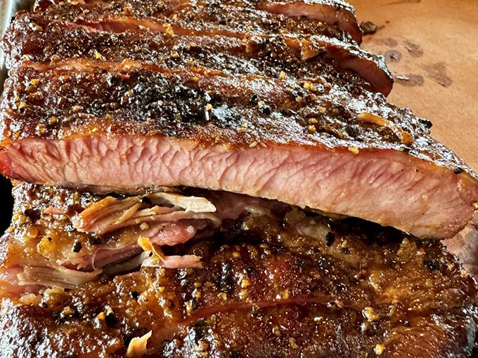 These ribs have the kind of bark that makes you want to bite, not run. The smoke ring is practically a halo. 