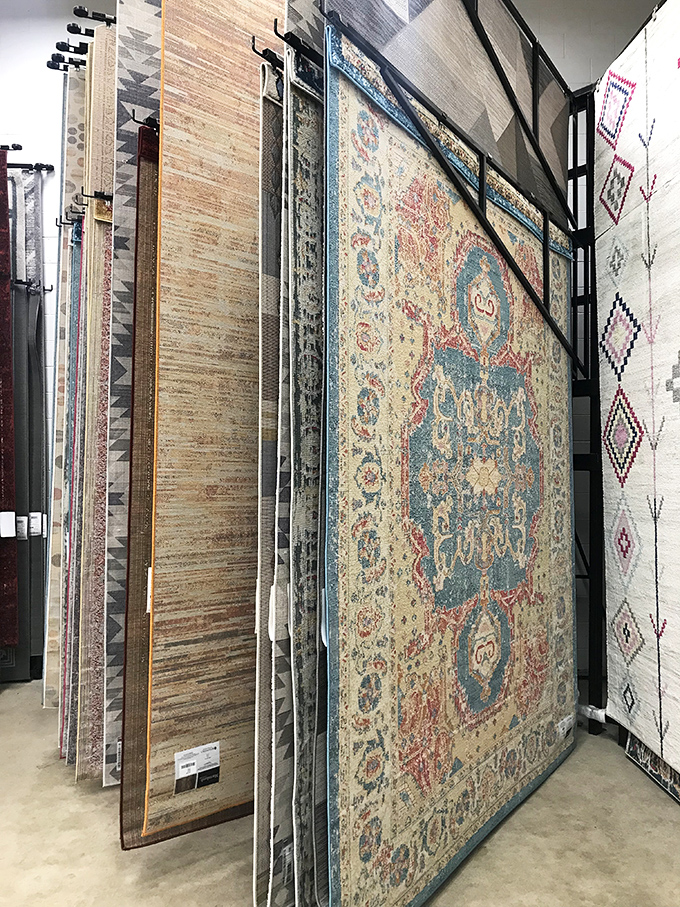 Area rugs displayed like art in a gallery, except this gallery understands that floors need covering without financial devastation.