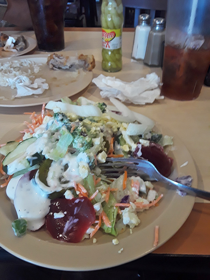 The salad plate&mdash;that noble attempt to balance the scales of nutrition before surrendering to the siren call of fried everything else.
