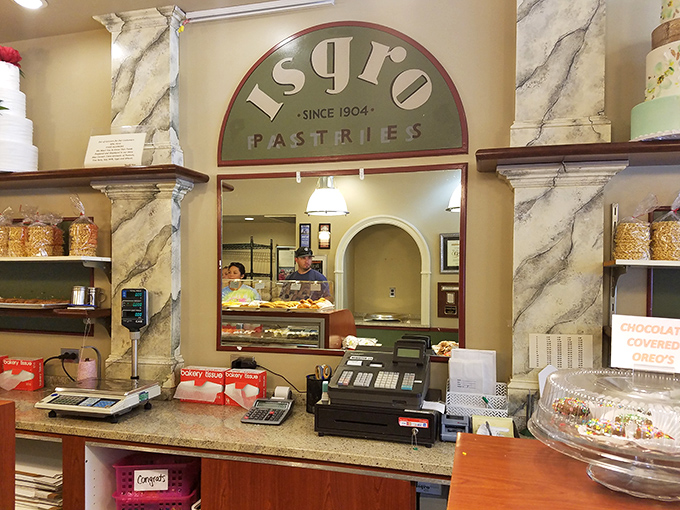 The marble-accented interior speaks to old-world elegance, while the logo reminds you this place has survived two world wars and countless diet resolutions.