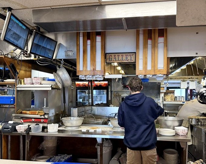 Where the magic happens. The kitchen at Woodman's isn't just cooking food&mdash;it's preserving a century-old New England tradition.