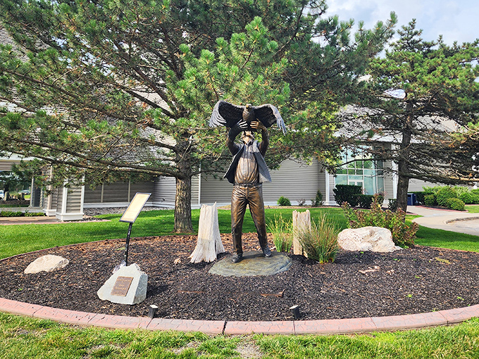 A bronze tribute to bird watching enthusiasm that perfectly captures that "Did you see it?!" moment every nature lover knows.