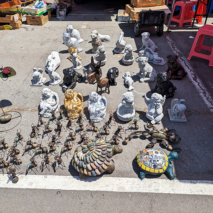 Garden guardians galore! This concrete menagerie of dogs, turtles, and mystical creatures stands ready to protect your petunias with stony determination.