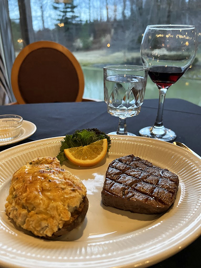 The perfect surf and turf pairing &ndash; a filet with textbook grill marks alongside what appears to be a loaded baked potato, with nature's backdrop through the window. 