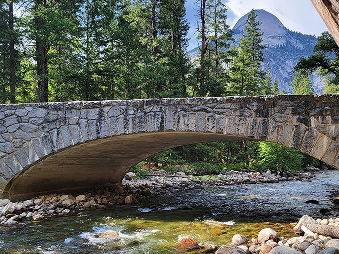 This isn't just any bridge&mdash;it's a century-old masterpiece where countless hikers have paused to catch their breath and their first waterfall glimpse.
