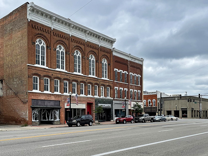 Main Street's brick buildings march along like well-behaved soldiers, each one maintaining perfect historic formation.