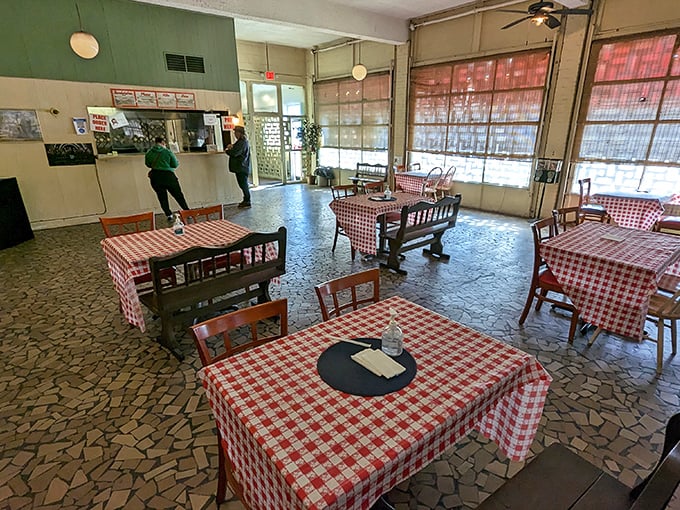 The dining room feels like stepping into barbecue history. Those stone tiles have witnessed countless moments of first-bite barbecue euphoria.