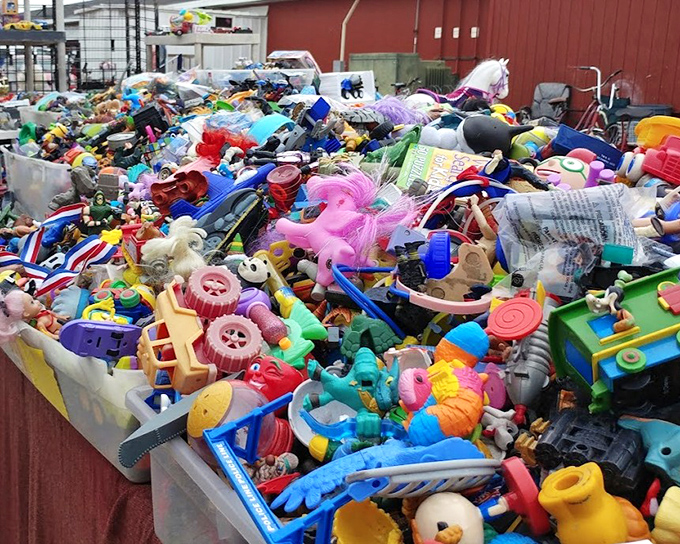 A mountain of plastic playthings that would make any yard sale enthusiast weak at the knees – childhood memories sold by the pound.