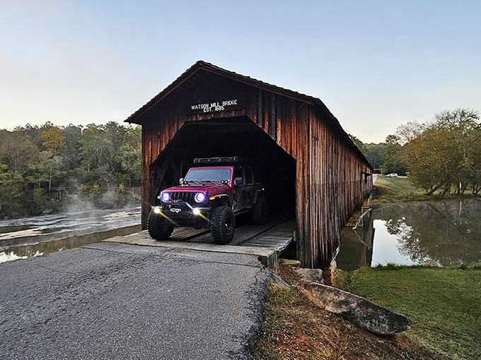A modern Jeep crosses the historic span&mdash;a perfect metaphor for how this bridge connects past and present without missing a beat.