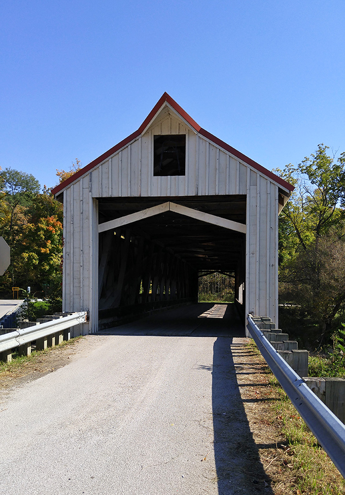 The bridge stands sentinel against a brilliant blue Ohio sky, its white siding practically glowing in the sunshine like a beacon to history buffs.