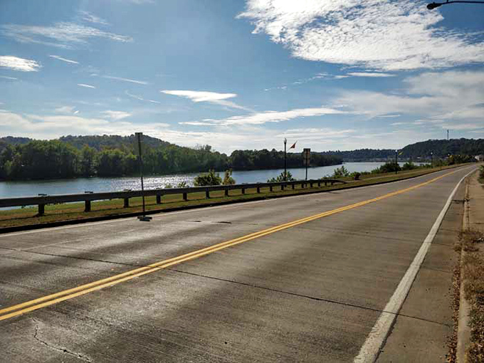 The byway reveals itself in stretches of perfect asphalt, where the guardrail serves as a picture frame for Ohio's liquid masterpiece. 