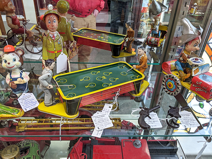 Tin toys with painted smiles that have outlasted decades of battery-operated fads. That little pinball game probably entertained kids during the Eisenhower administration.