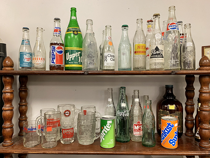 The evolution of American refreshment in glass form. These vintage bottles showcase brand designs that have become cultural icons over decades.