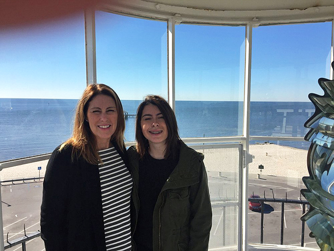 Visitors enjoying the panoramic view that lighthouse keepers once monitored for approaching vessels and brewing storms.