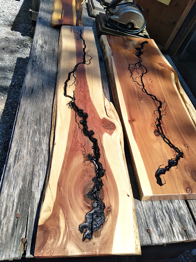 Nature meets artistry in these live-edge wood slabs. The black inlay follows the wood's natural imperfections, creating functional river maps.