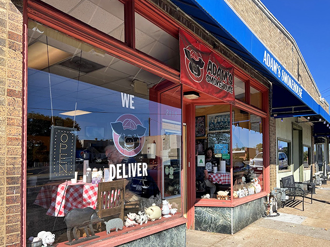 Adam's Smokehouse's charming storefront window display hints at the pork-centric paradise waiting inside.