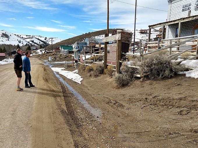 South Pass City's ghost town streets whisper tales of boom and bust, where modern visitors contemplate life's fleeting fortunes.