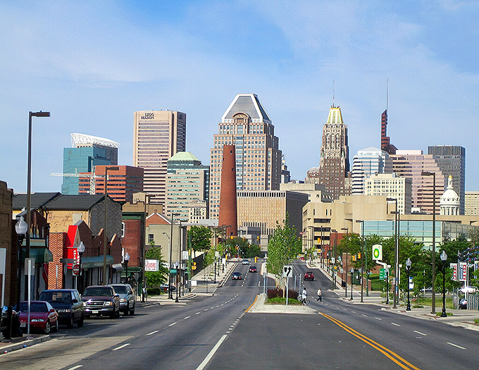 Baltimore's skyline rises majestically behind historic neighborhoods. The perfect blend of gritty history and modern ambition!