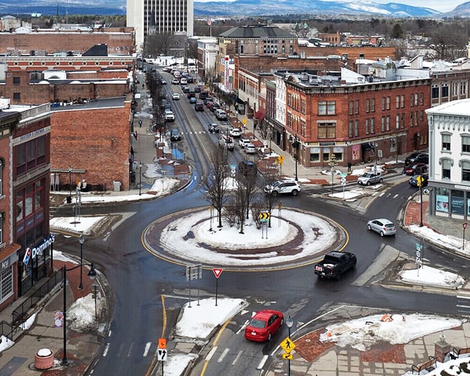 Glens Falls' traffic circle serves as the beating heart of downtown, where brick buildings and mountain views create a Norman Rockwell scene with modern affordability.