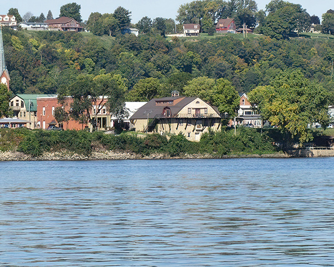 Guttenberg's riverside homes cling to the hillside like colorful barnacles, offering residents front-row seats to Mississippi River sunrises.