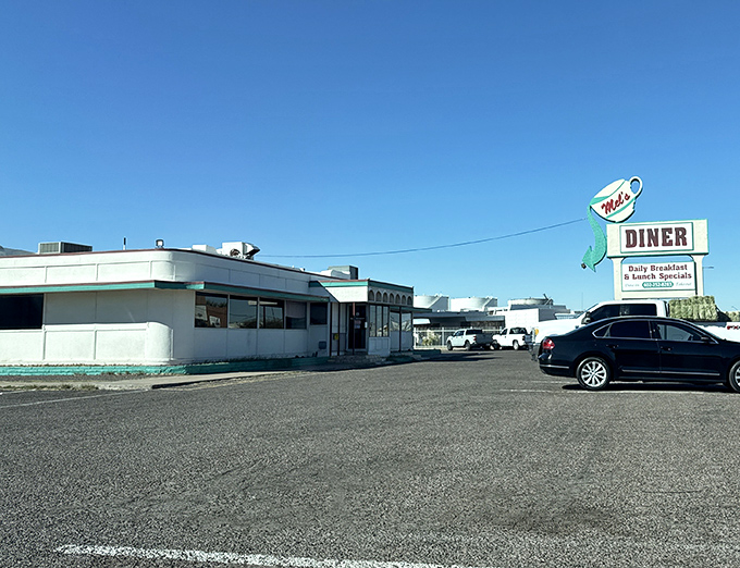 Mel's vintage sign stands tall against the Arizona sky &ndash; a landmark for those who take their breakfast seriously.