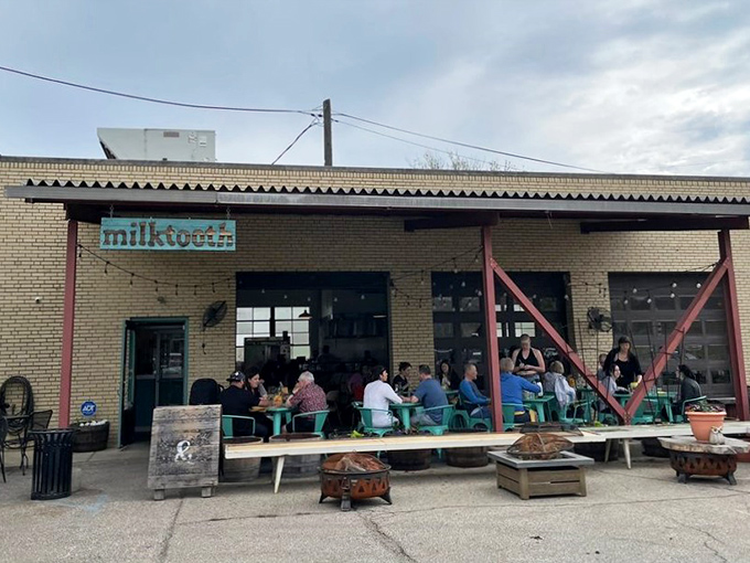 Milktooth's industrial-chic exterior hints at its auto shop origins. This isn't your grandpa's breakfast joint – unless your grandpa was incredibly cool.