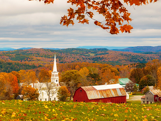 If Norman Rockwell and Mother Nature collaborated on a painting, this Peacham church and barn amid fall foliage would be their masterpiece.