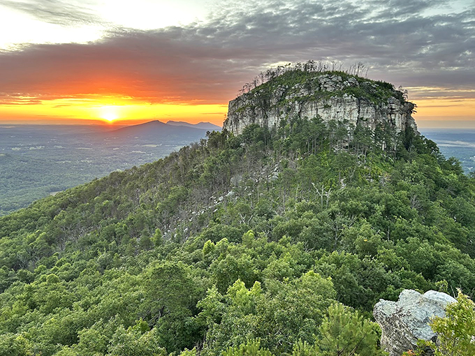 Sunset magic! Pilot Mountain's silhouette against a painted sky makes you realize why people wrote songs about places like this.