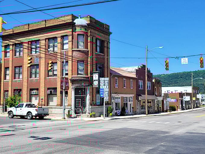Romney's corner building commands the intersection like a brick sentinel. That rounded turret has probably witnessed a century of traffic lights changing.