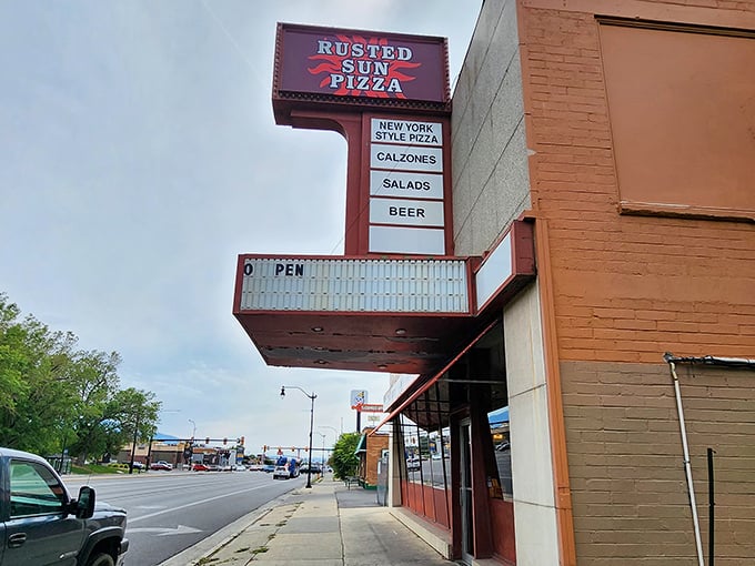 Rusted Sun's vintage marquee promises a classic pizza experience. No frills, just thrills for your taste buds.