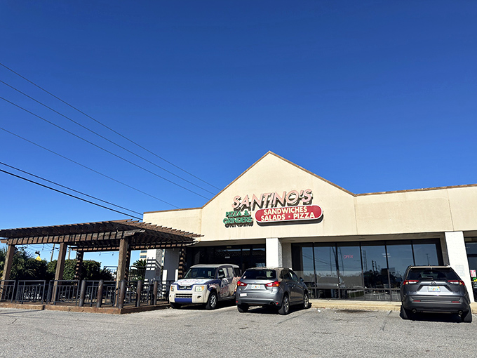 Santino's branded delivery vehicle stands ready to bring pizza happiness to Pensacola homes. The pergola-covered patio looks mighty inviting too.
