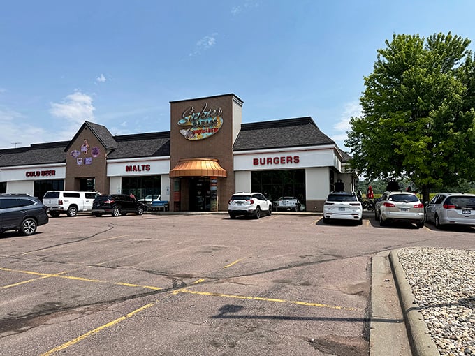 Sickies Garage exterior promises fun before you even walk in. The burger sign doesn't mention their secret chicken weapon.