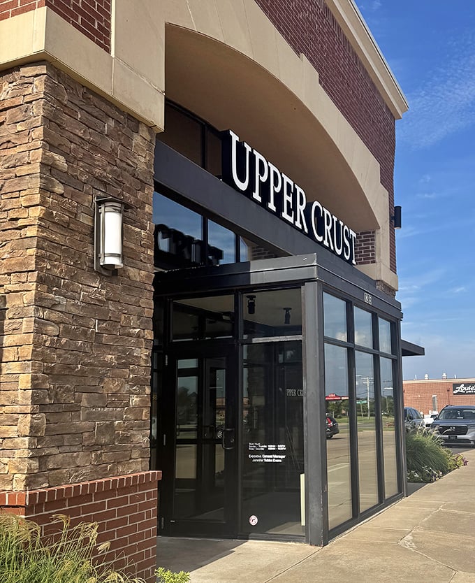 Upper Crust's modern stone and glass fa&ccedil;ade speaks to its contemporary approach. Wood-fired perfection awaits behind those sleek doors.