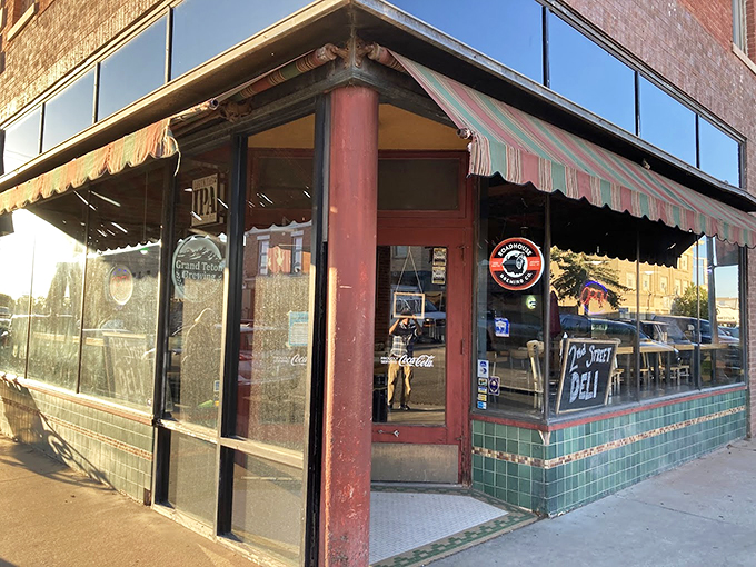 The classic striped awnings of Sweet Melissa frame a corner entrance that's welcomed hungry Laramie visitors for generations.