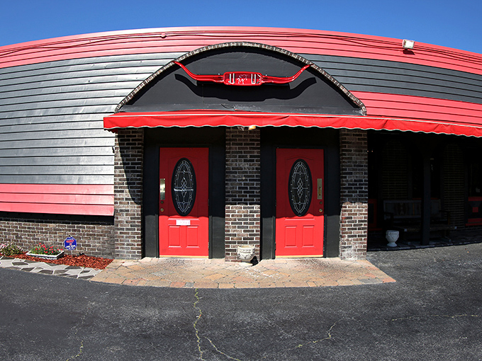 Those distinctive red doors at Angus Steakhouse are like portals to a world of perfectly seared beef and seafood delights.