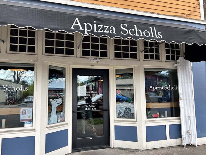 The classic black awning with white lettering keeps things classy&mdash;just like their approach to pizza perfection that draws lines before opening.
