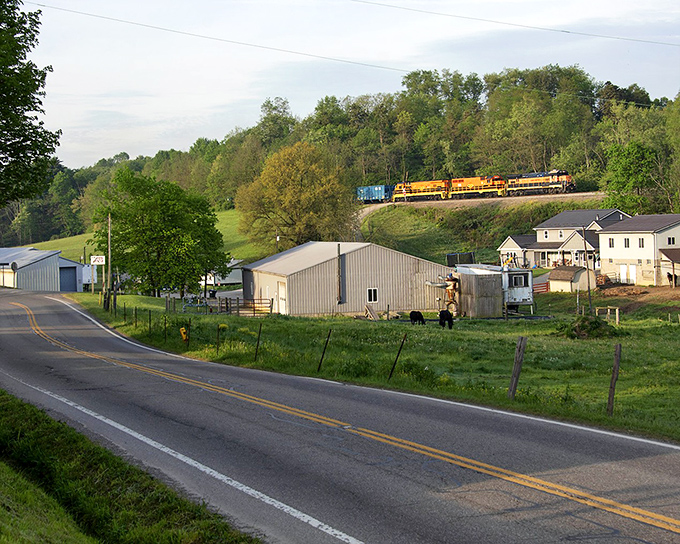 Rural simplicity defines the approach to Apple Creek. Fields and farms create a patchwork landscape of working countryside.