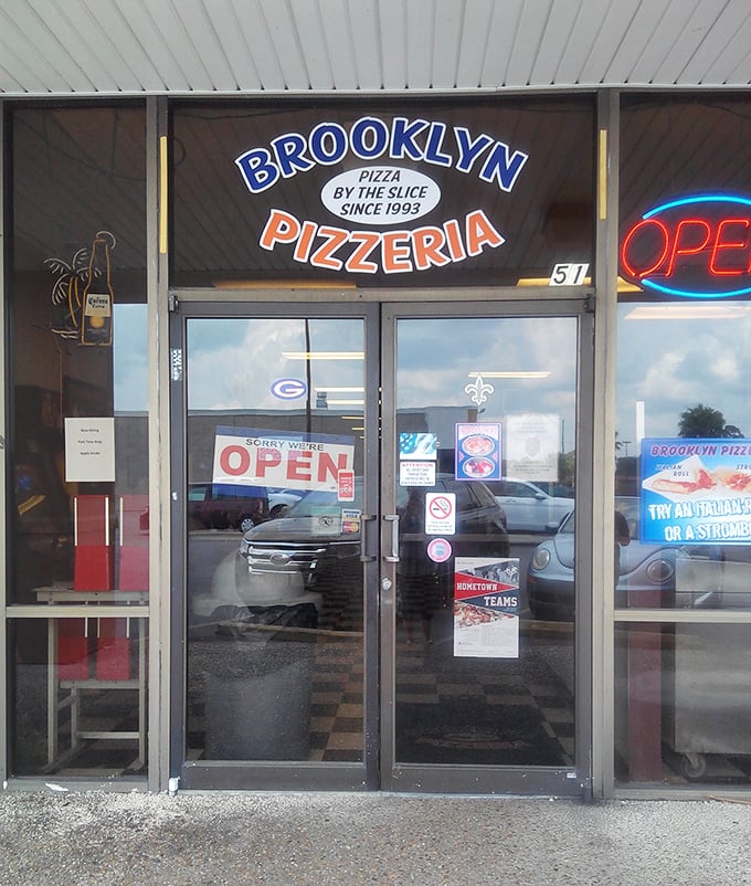 Brooklyn Pizzeria's straightforward storefront promises no-nonsense New York slices. That checkerboard floor says "authentic" before you even taste the pizza!