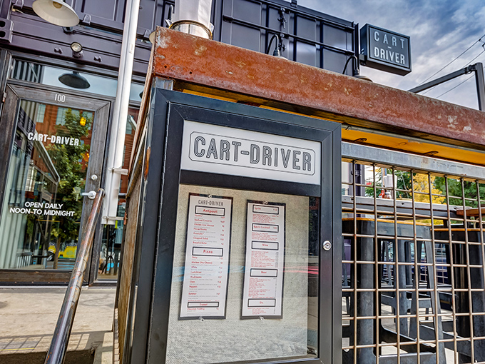 The minimalist menu board outside Cart-Driver hints at the focused pizza perfection waiting inside. Small space, enormous flavors.