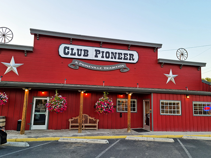 The hanging flower baskets and welcoming bench outside Club Pioneer say "come as you are." Inside those doors, cowboy-sized steaks await hungry travelers and locals alike.