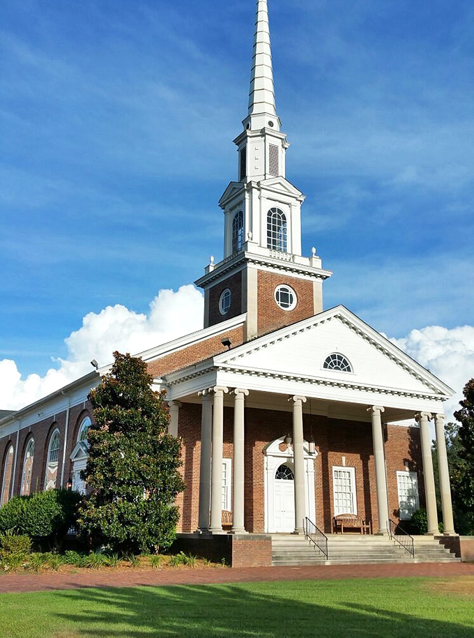 Where red brick buildings stand strong like dependable friends who've weathered every storm together. 