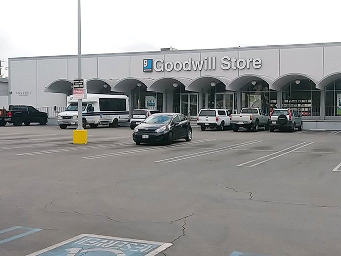 The arched entryway of this Goodwill store welcomes shoppers like a cathedral of secondhand treasures. Even the architecture says "come inside."
